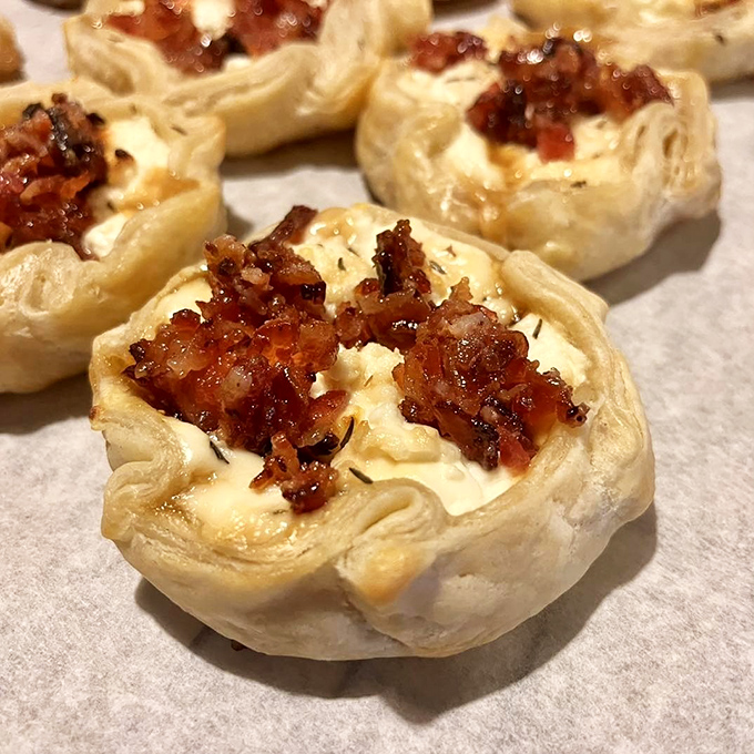 These savory bites combine crispy bacon with creamy cheese in puff pastry shells &ndash; a flavor explosion that fits in the palm of your hand.