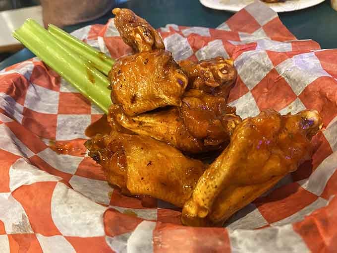 Golden, crispy, and glistening with sauce, these wings arrive hot enough to make you practice patience you didn't know you had.