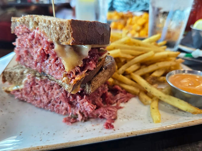 This isn't just a sandwich; it's an architectural marvel of tender corned beef, melty cheese, and perfectly grilled rye &ndash; comfort on a plate.