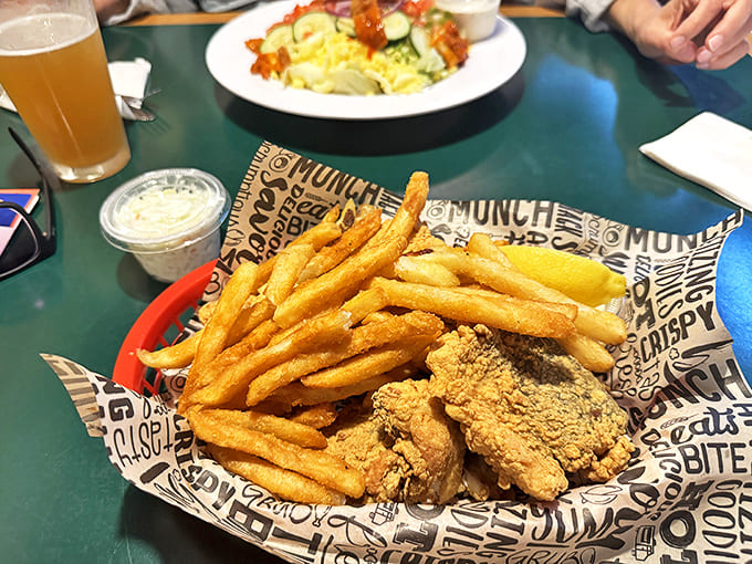 Golden-fried chicken nestled alongside perfectly crisp fries—comfort food that speaks the universal language of "Oh my goodness, that looks amazing!"