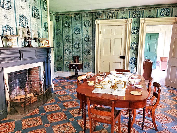 Step into this dining room and you'll swear Martha Washington might walk in any minute. The blue toile wallpaper and period furniture create a tableau of refined 19th-century domestic life.