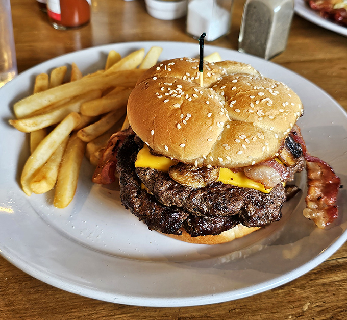 This isn't just a burger, it's a revelation &ndash; a perfect harmony of juicy beef, melted cheese, crispy bacon, and fresh vegetables on a toasted sesame bun.