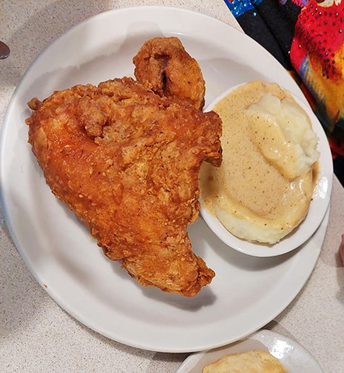 Golden-brown fried chicken that achieves the perfect crispy-to-juicy ratio &ndash; the kind that makes you wonder if they've somehow bottled nostalgia.