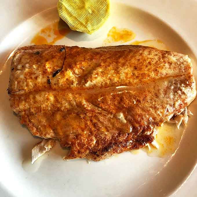 This isn't just grilled fish; it's a perfectly seasoned, butter-kissed revelation that might make you forget every other seafood experience.