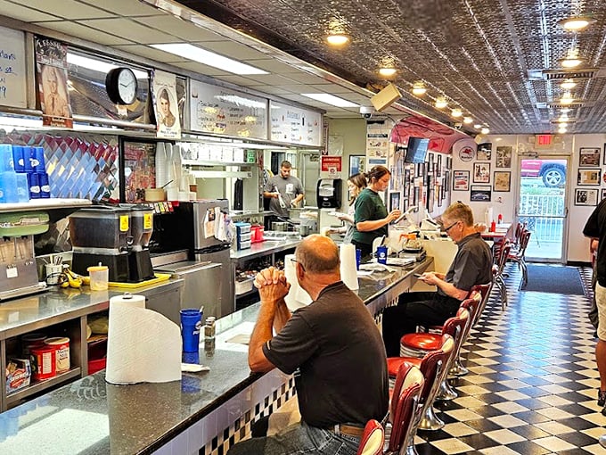 Where Elvis meets eggs! The checkered floor and chrome stools set the stage for a breakfast performance that would make the King himself all shook up.