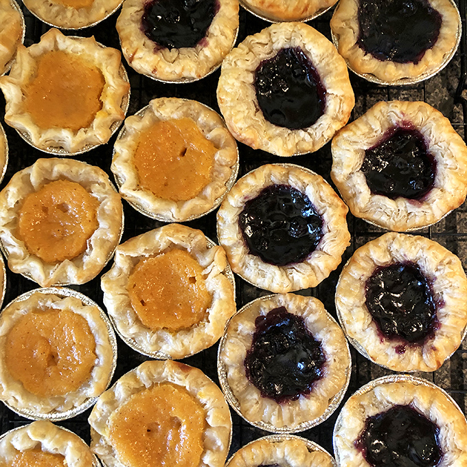 These mini jam tarts are like edible jewelry boxes &ndash; each one hiding a treasure of fruit filling that pops with brightness against the buttery crust.