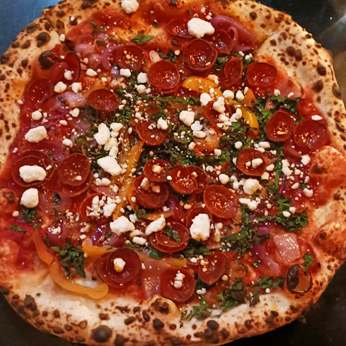 Blistered perfection &ndash; the telltale char marks of a properly wood-fired Neapolitan pizza create that irresistible combination of crispy and chewy textures.