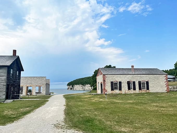 Stone buildings perch near the shoreline, where Lake Michigan's crystal waters now peacefully lap at what was once a bustling industrial harbor.