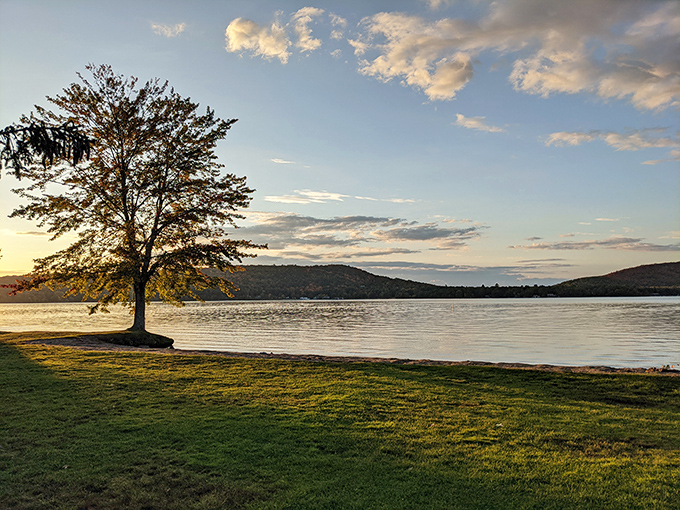 Sunset serenity by the shore &ndash; when day meets evening and the lake becomes liquid gold.