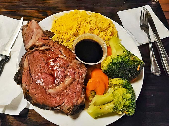 This prime rib plate isn't just dinner&mdash;it's a carnivore's dream with perfectly cooked beef, vibrant vegetables, and golden rice.