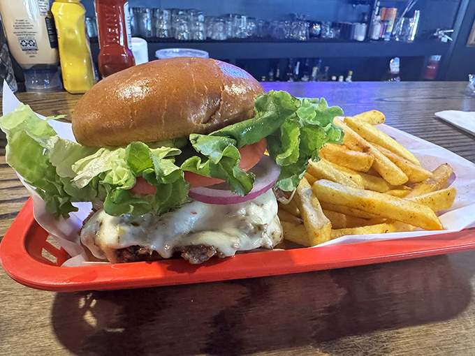 Behold burger perfection! Crispy-edged patty meets garden-fresh toppings on a pillowy bun &ndash; a masterclass in simplicity done right.