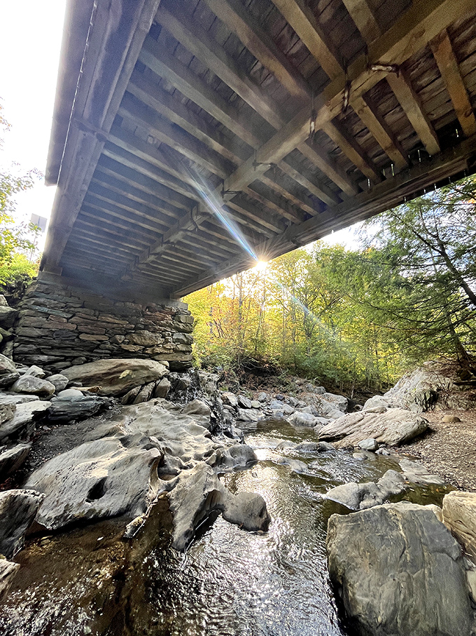 Beneath the haunted passageway, Gold Brook babbles innocently, unaware of the tragedy that supposedly unfolded above its waters generations ago.