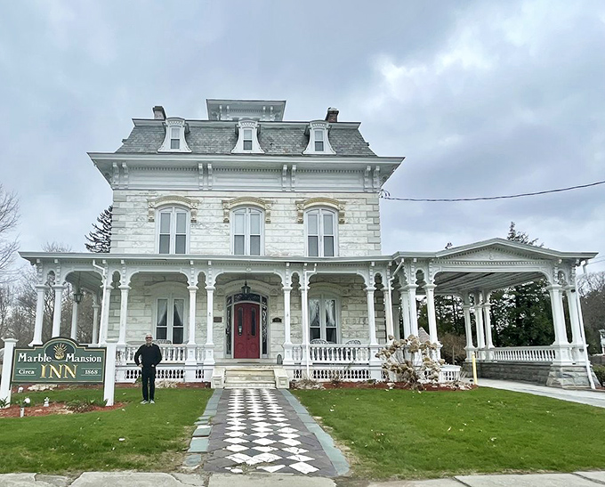The checkerboard pathway leads visitors to grand adventures, promising stories that begin the moment you step onto the property.
