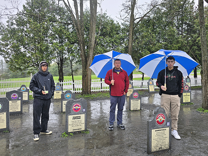 Even in the rain, ice cream enthusiasts pay their respects to fallen flavors, proving dedication knows no weather limitations.