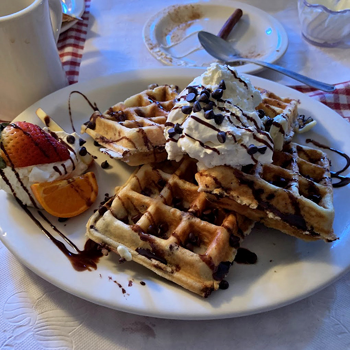 These chocolate chip waffles aren't just breakfast &ndash; they're an event, complete with whipped cream mountains and chocolate drizzles that make adults giggle like children.