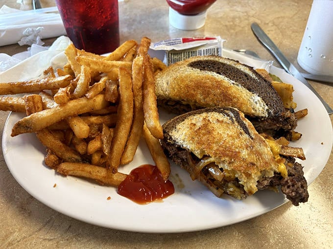 The display case showcases rows of handcrafted truffles, each one a miniature work of art with flavors ranging from classic to adventurous.
