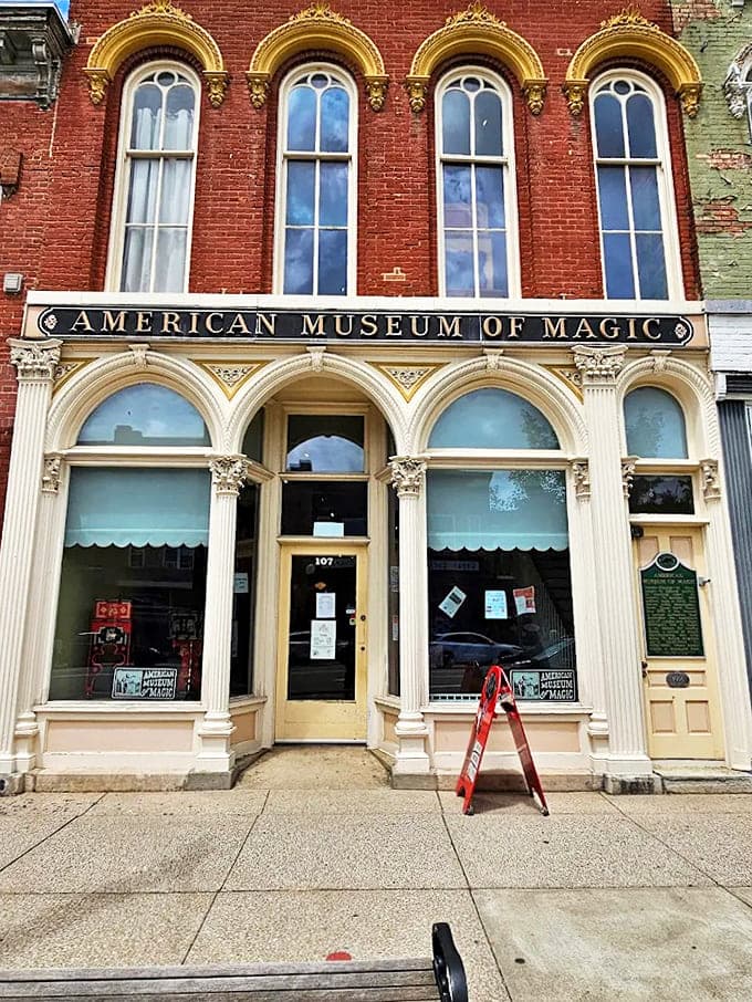 The American Museum of Magic's elegant storefront features tall arched windows and classic architectural details, a fitting home for mysterious wonders.
