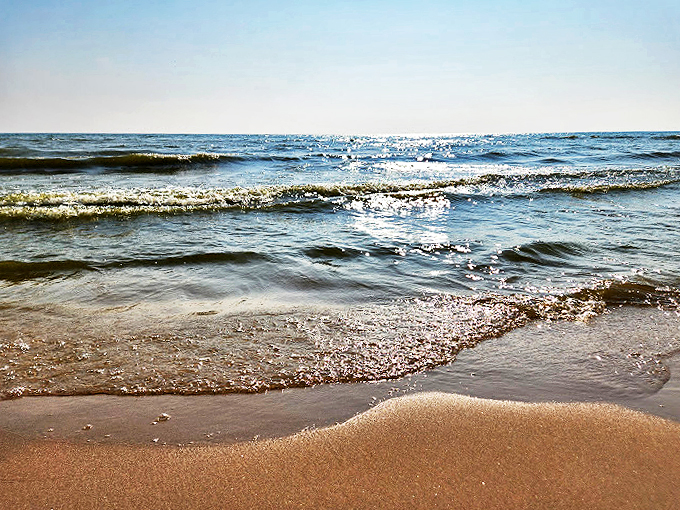 Crystal-clear shallows invite waders, while the distant horizon beckons more adventurous swimmers. Choose your own aquatic adventure!