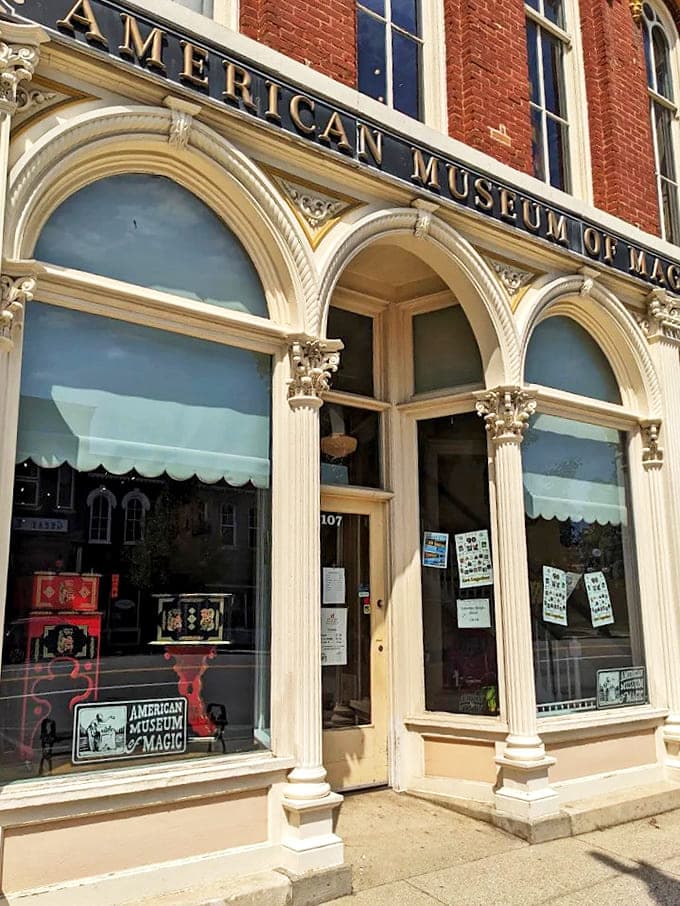 Golden lettering and ornate columns frame the entrance to the American Museum of Magic, where illusions and history combine in downtown Marshall.