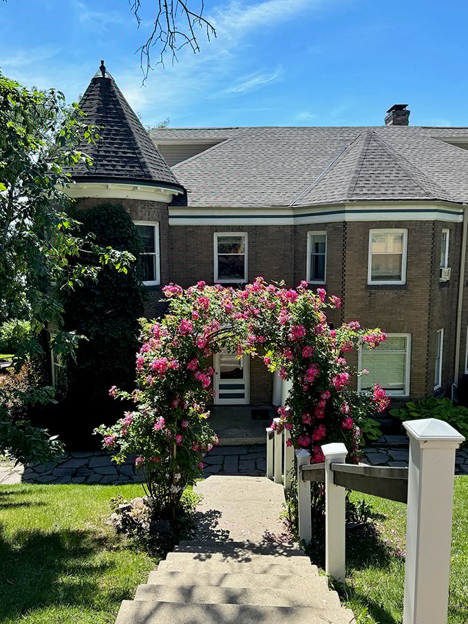 Pink roses frame the entrance to Shorewood Castle's Tower Suite, adding a romantic touch to this hidden gem that offers visitors the rare chance to sleep in their very own castle tower.