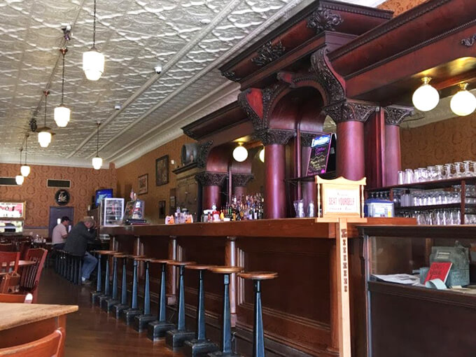 Pull up a stool to nostalgia central! With its pressed tin ceiling and vintage charm, this bar's been serving up good times since before your grandpa was knee-high to a barstool.