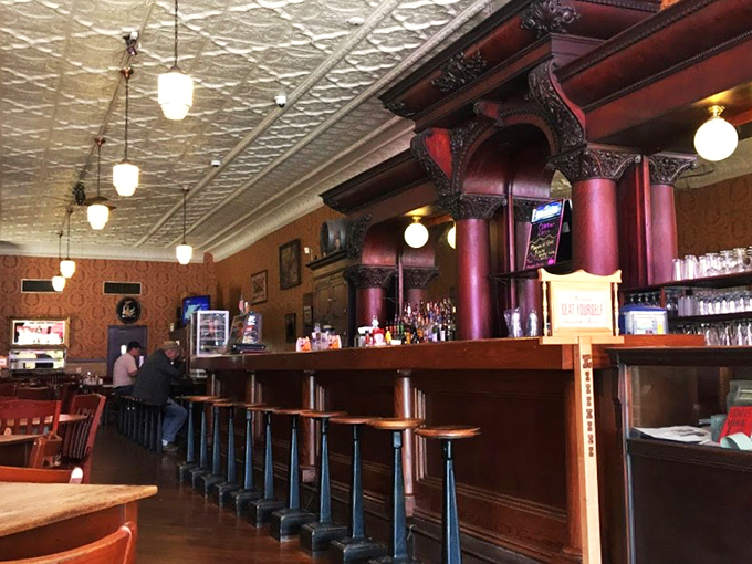 Pull up a stool to nostalgia central! With its pressed tin ceiling and vintage charm, this bar's been serving up good times since before your grandpa was knee-high to a barstool.