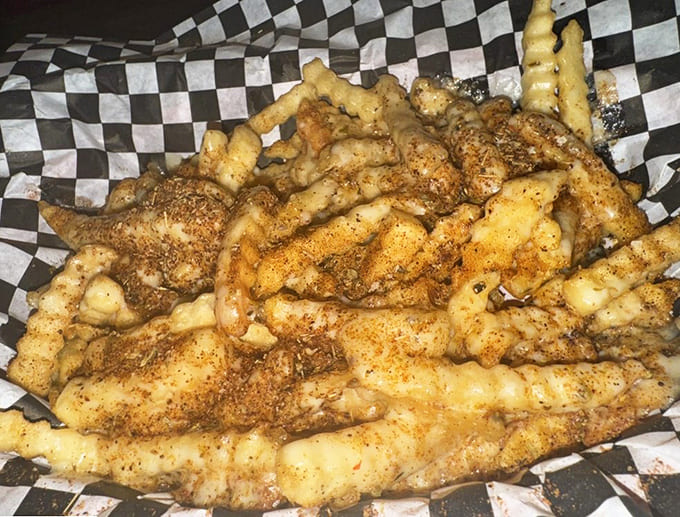 These Cajun cheese fries are what happens when someone decides regular fries need a spicy, cheesy promotion.