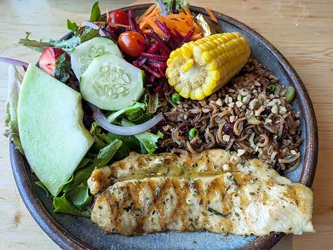 Grilled trout with colorful vegetables looks almost too pretty to eat, but you'll get over that hesitation quickly once you taste it.