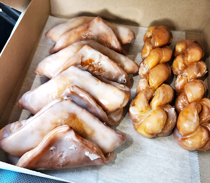 A box of glazed temptations that makes you understand why people commit crimes of passion. These aren't just donuts; they're relationship material.