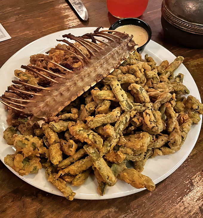 Crispy, tender rattlesnake meat surrounds the skeletal remains – a conversation starter that's equal parts delicious and daring for adventurous eaters.