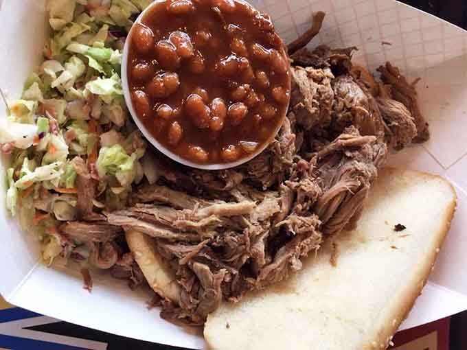 Pulled pork piled high with beans and slaw is the holy trinity of barbecue plates, comfort food that makes you forget whatever was bothering you.