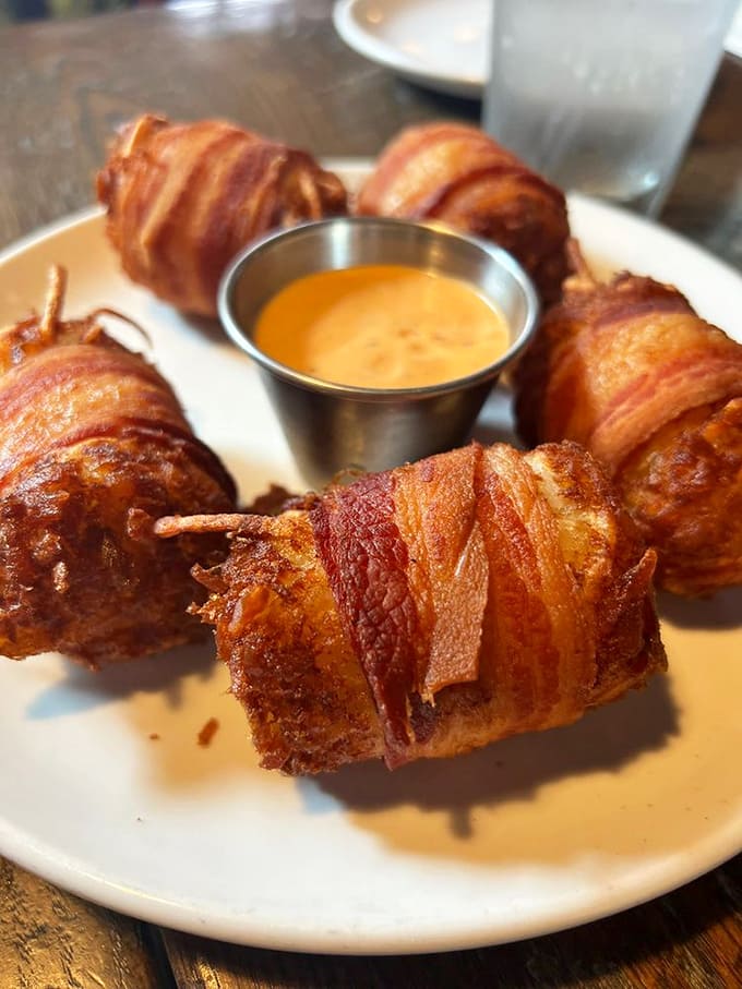 Bacon-wrapped tots &ndash; because regular tater tots weren't indulgent enough. The spicy cheese dip takes this appetizer from "why not" to "why haven't I always eaten these?"