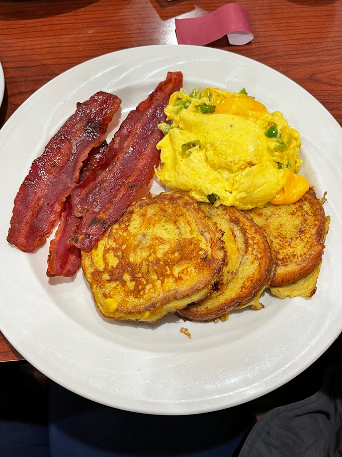 Golden French toast, crispy bacon, and a fluffy omelet&mdash;the holy trinity of breakfast done right.
