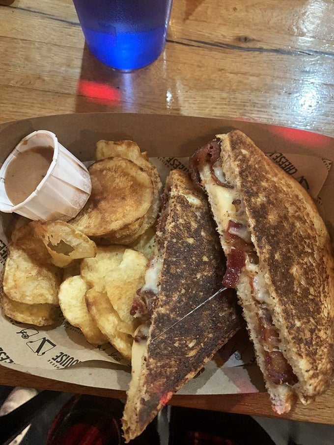 The holy grail of comfort food: bacon grilled cheese that's crispier than your grandpa's jokes and gooier than a rom-com ending.