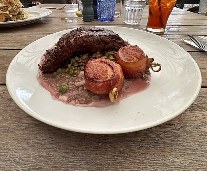 Bacon-wrapped scallops flanking a perfectly cooked steak&mdash;proof that sometimes the best relationships are the ones that cross boundaries.