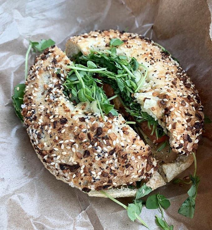 The everything bagel sandwich &ndash; where seeds, greens, and dreams come together in perfect harmony on freshly baked perfection.
