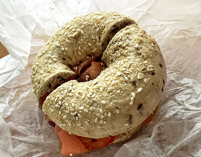 A sesame bagel cradles lox in this classic pairing – the seeds adding nutty notes to complement the silky salmon.