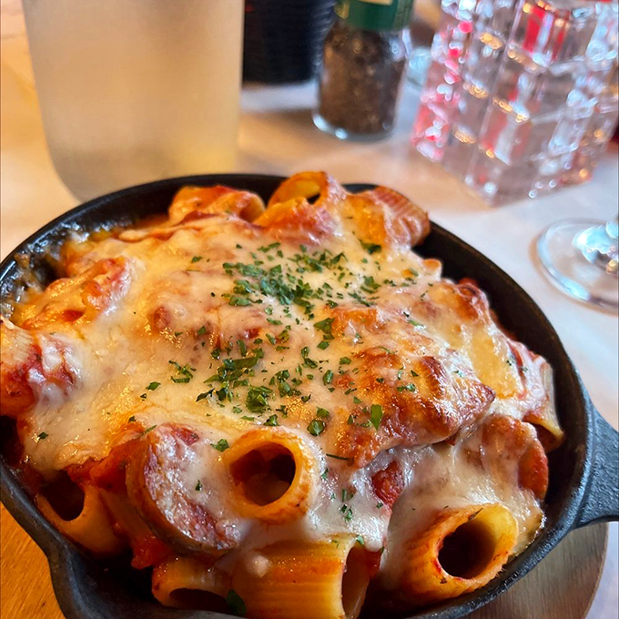 The Baked Rigatoni arrives bubbling hot in its skillet, cheese stretching with each forkful &ndash; a dish worth fighting over until the last bite.