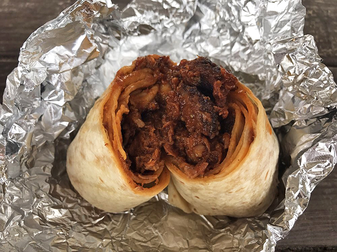 Behold, the burrito that broke the mold! This BBQ-filled beauty is like a warm, porky hug wrapped in a tortilla blanket.