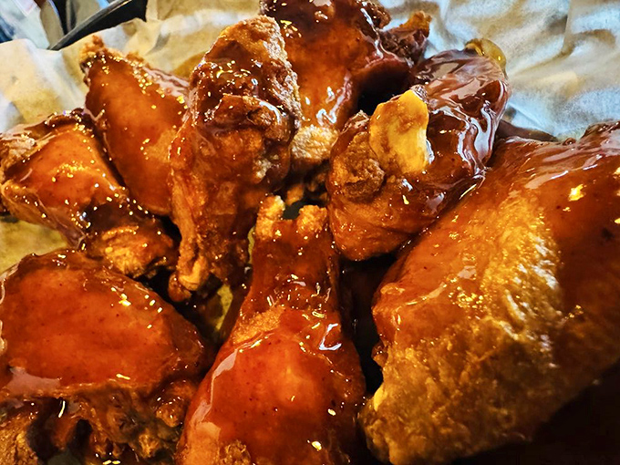These BBQ wings glisten with sticky, sweet-spicy sauce &ndash; the kind that requires extra napkins and leaves you unashamedly licking your fingers afterward.
