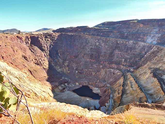 The Lavender Pit stretches out like a massive geological amphitheater, reminding visitors that humans once moved mountains here, literally, one ton at a time.