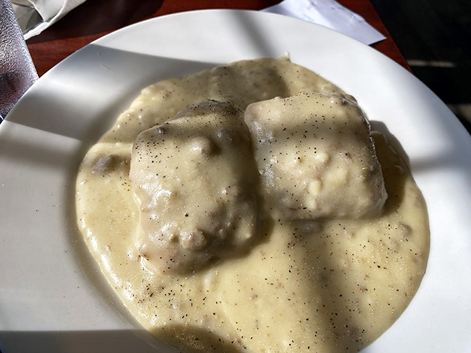 Fluffy biscuits swimming in creamy gravy &ndash; it's not just breakfast, it's a warm hug for your taste buds.