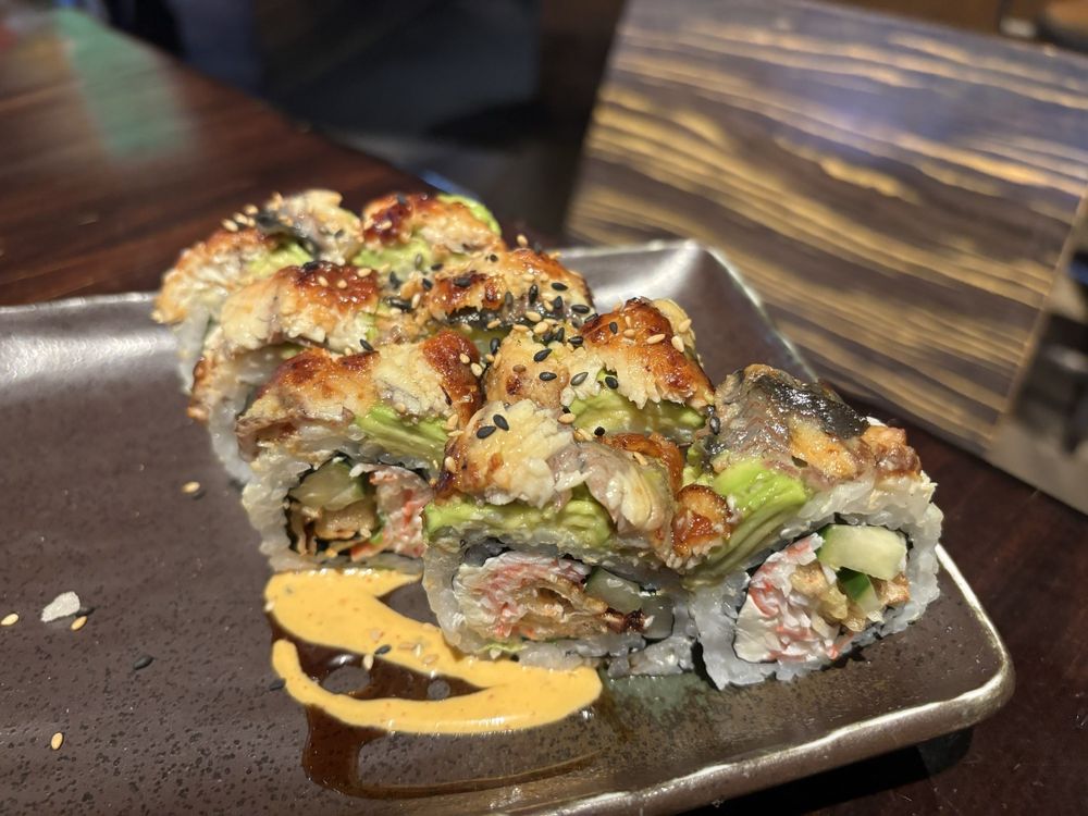 Layers of flavor and texture create an edible masterpiece – this isn't just sushi, it's architecture you can eat.