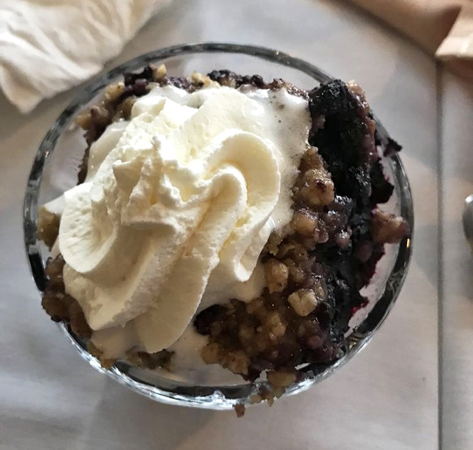 Heaven in a glass: wild blueberry cobbler topped with clouds of whipped cream that melt into the warm berry filling.