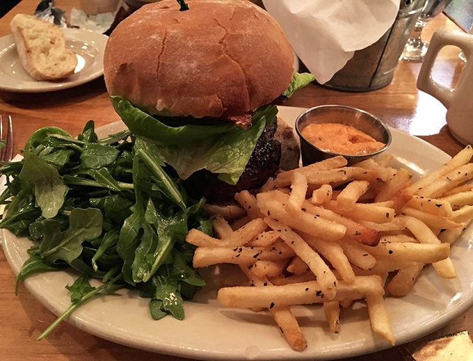 The Bobcat Burger arrives like a challenge to your jaw size &ndash; stacked with fresh ingredients and paired with fries that deserve their own fan club.