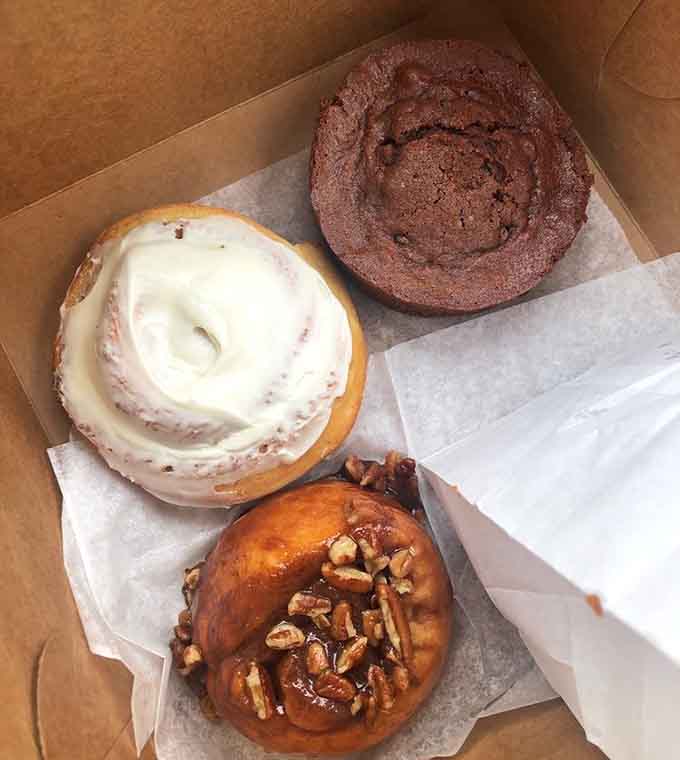 The holy trinity of morning carbs: chocolate coffee cake, cinnamon roll, and sticky bun walk into a bakery.