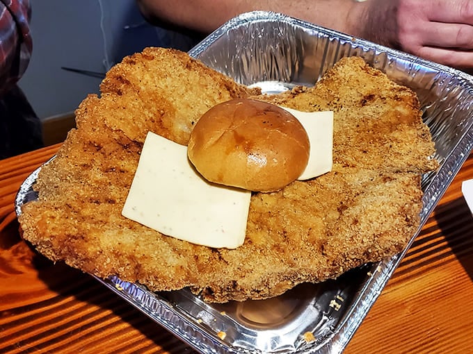 When a sandwich needs its own area code &ndash; the breaded tenderloin with cheese creates a crispy-melty masterpiece.