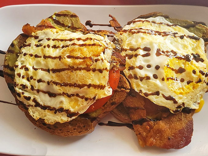 Eggs Benedict with a drizzle of balsamic &ndash; breakfast elevated without pretension, just pure morning bliss on an English muffin.