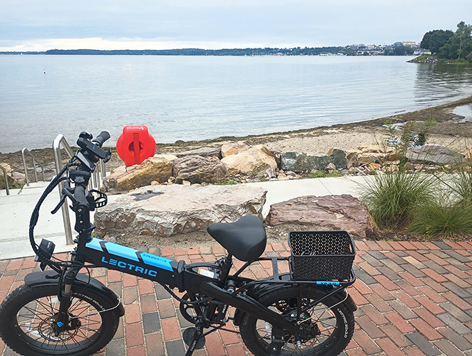 Brick pathways near the rocky waterfront create accessible routes for everyone to enjoy Lake Champlain's majestic shoreline.