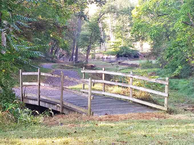 This unassuming wooden bridge spans more than just a stream &ndash; it's a crossing between centuries, connecting visitors to Ohio's industrial heritage.